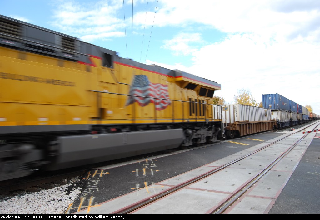 The picture didnt turn out so good because this fast Intermodal train was going fast number is ...